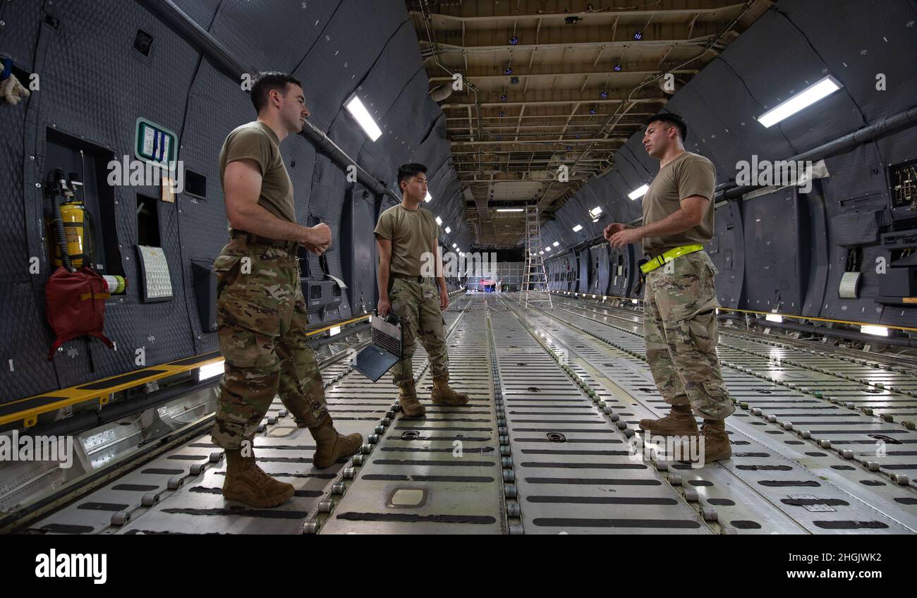 Staff Sgt. Adrian Diaz Jr., right, 730th Air Mobility Squadron engine ...