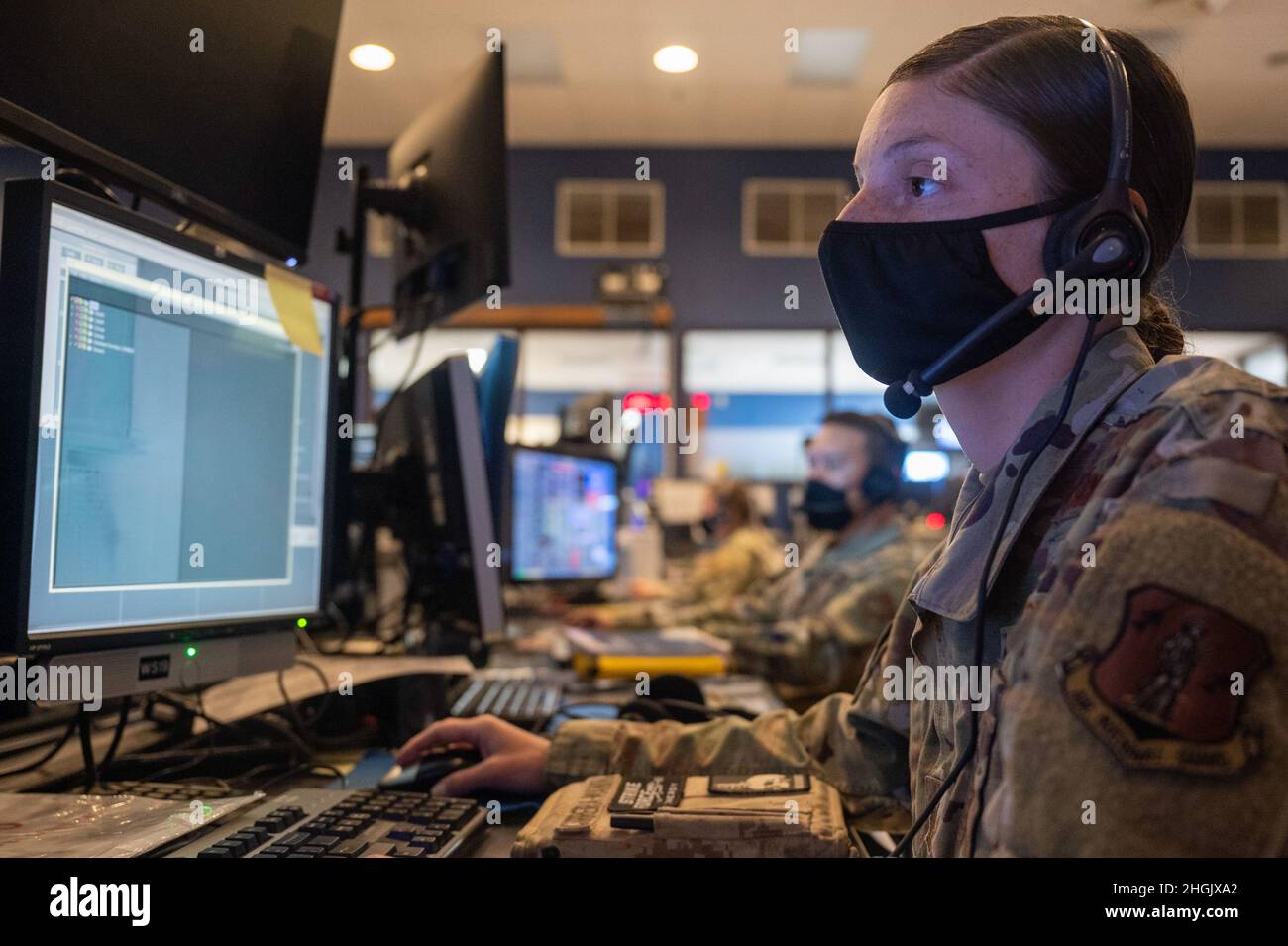 An enlisted weapons director from the 116th Air Control Squadron peers ...