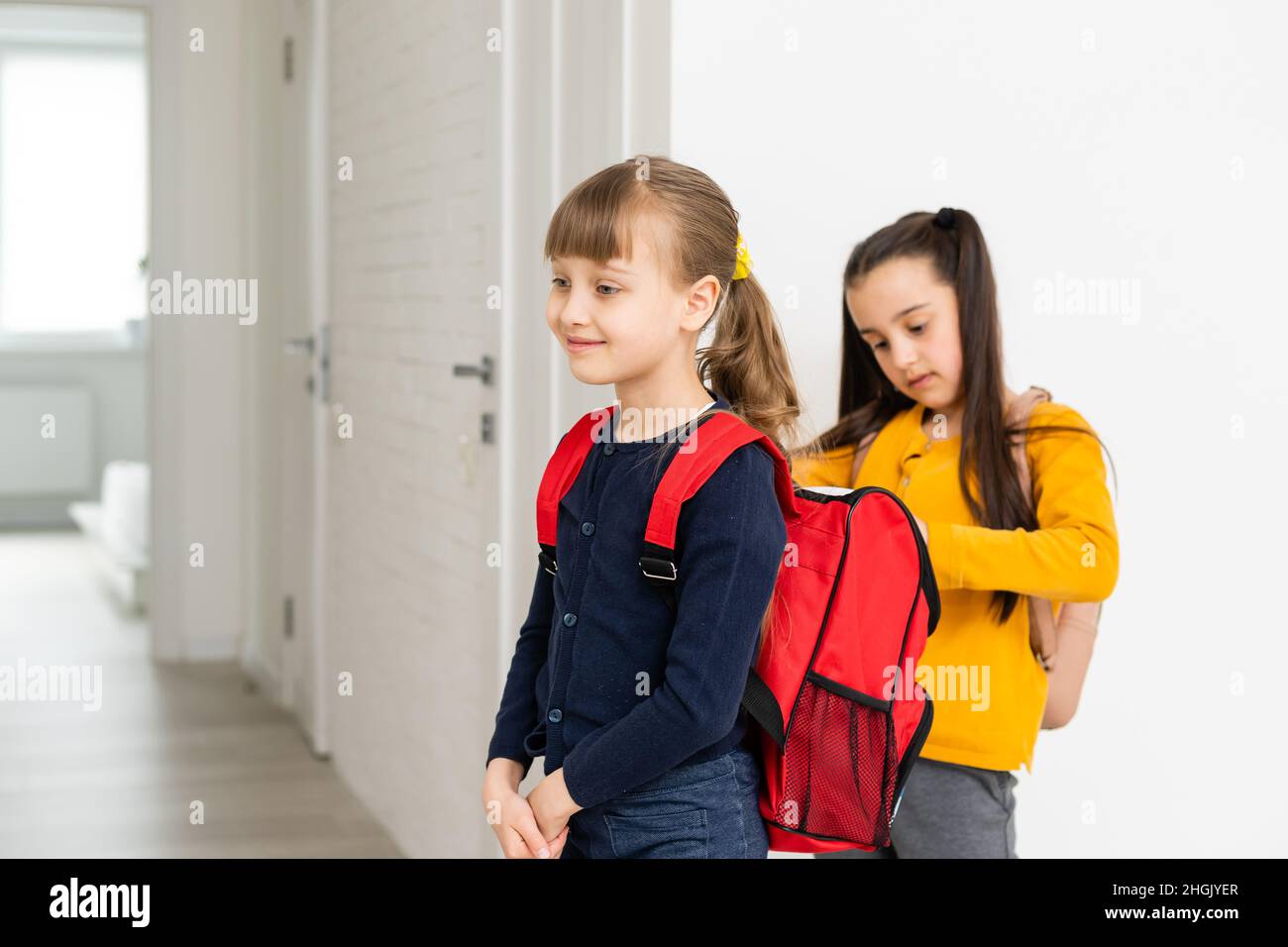 Two pupils of elementary school, Back to school Stock Photo - Alamy