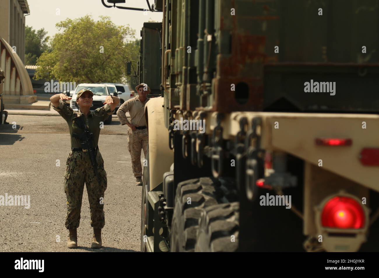 U.S. Navy Sailor, Seamon Yusra Marmash ground guides U.S. Marines ...