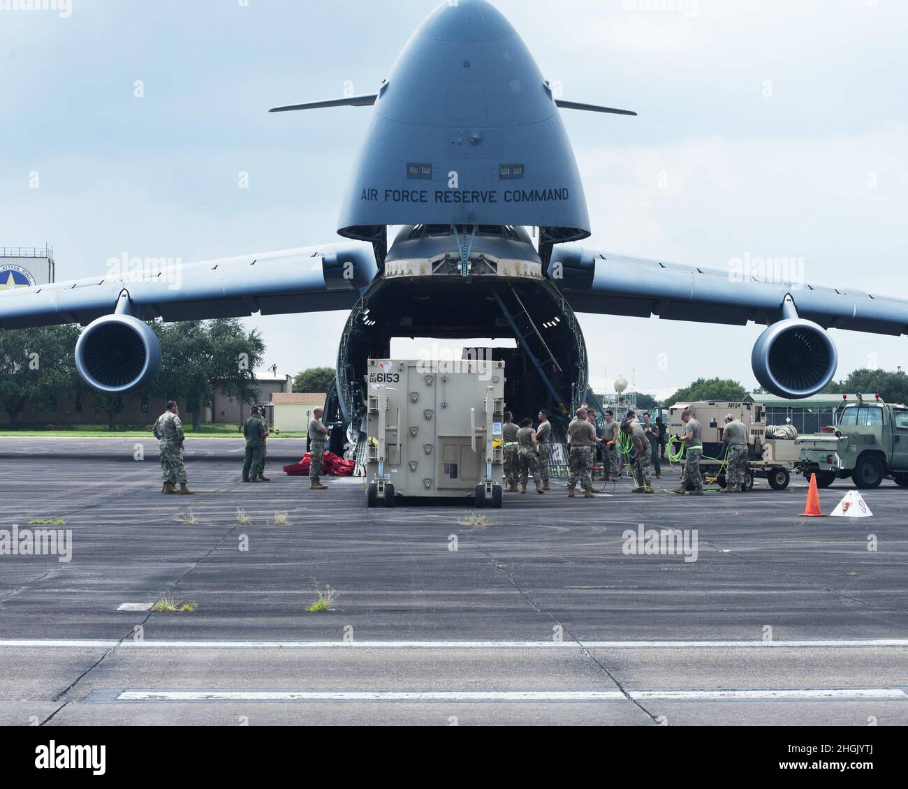 Members of the 147th Attack Wing prepare to load a ground control ...