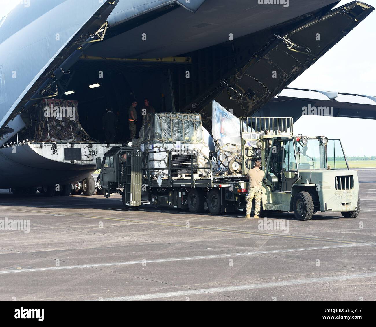 Members of the 147th Attack Wing with assistance from the 136th Airlift ...