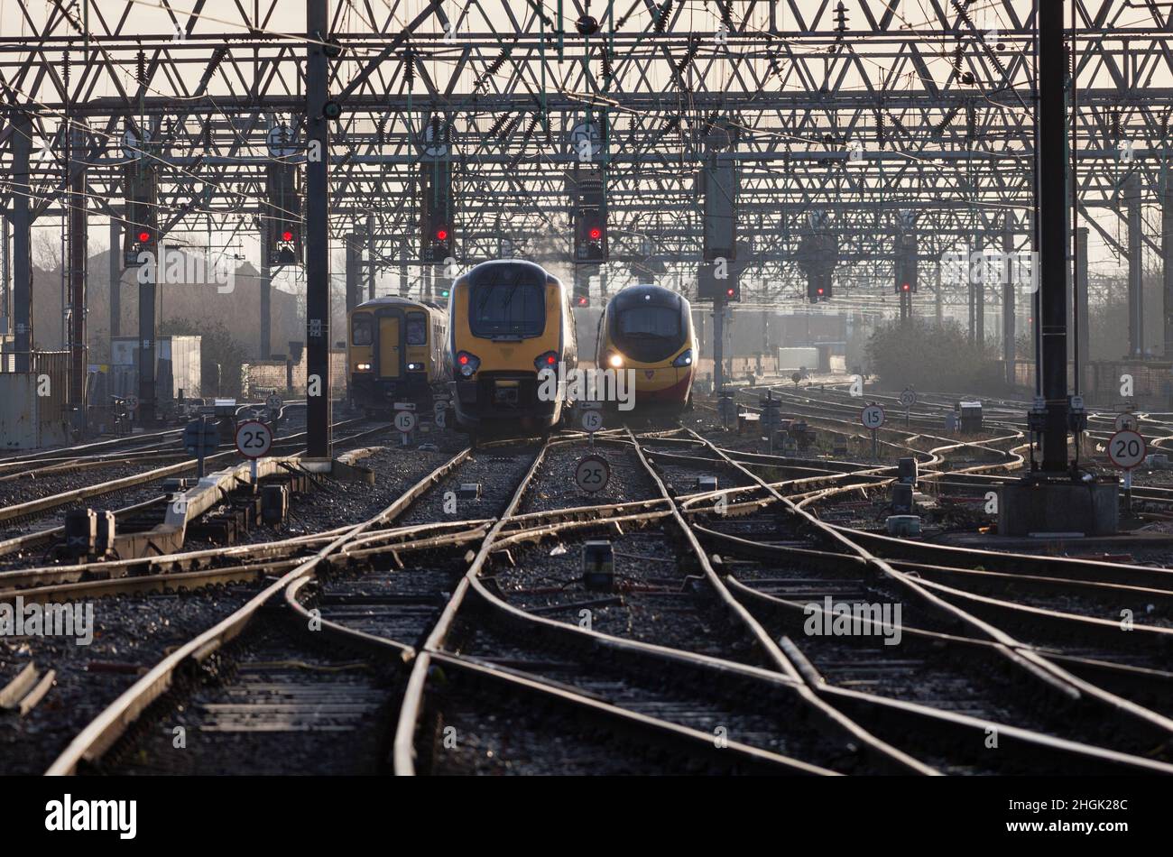 Northern Rail, Crosscountry trains and Virgin Trains passing with red ...