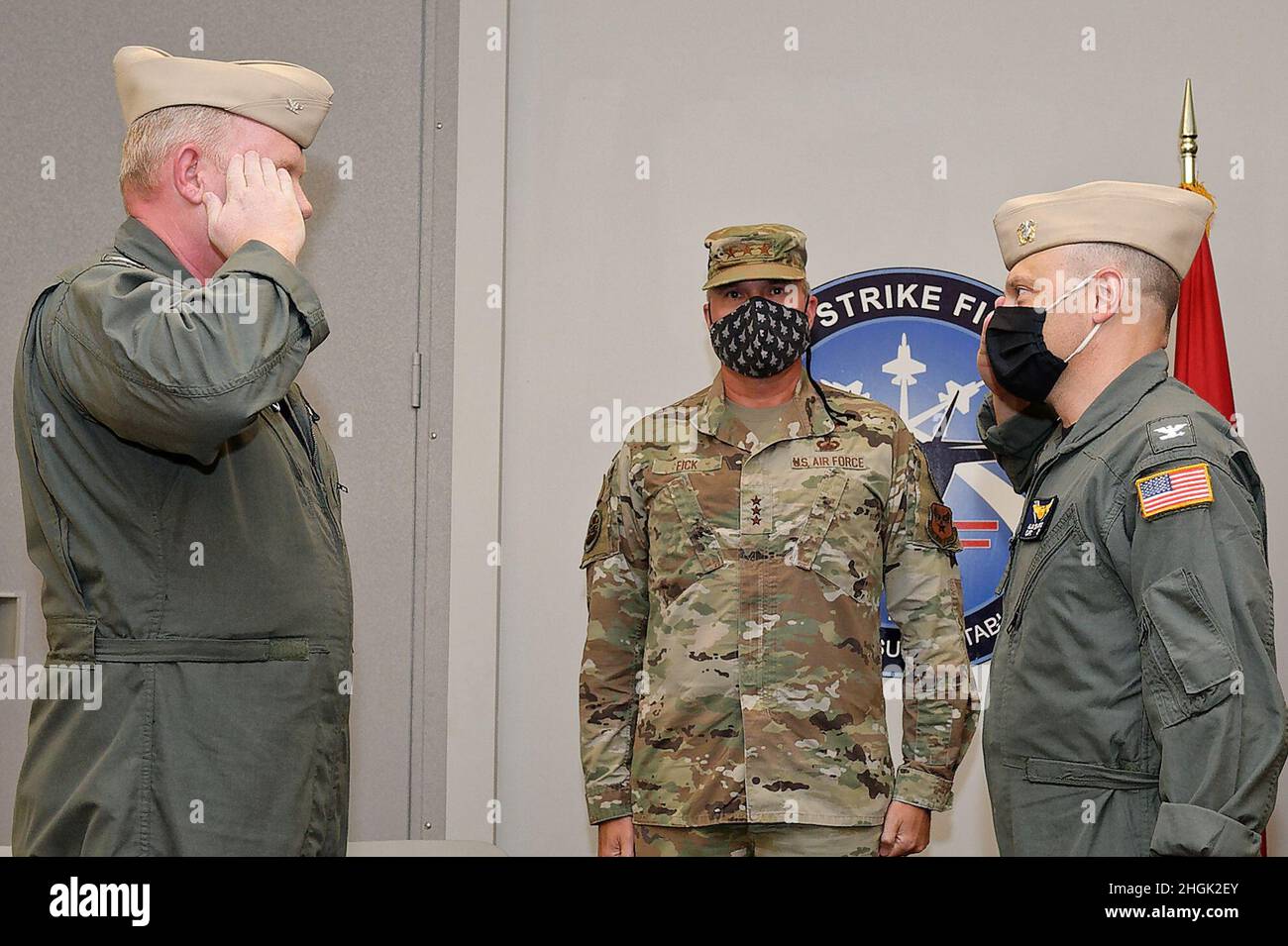 Navy Capt. Alan Schiaffino (right) salutes and assumes leadership of ...
