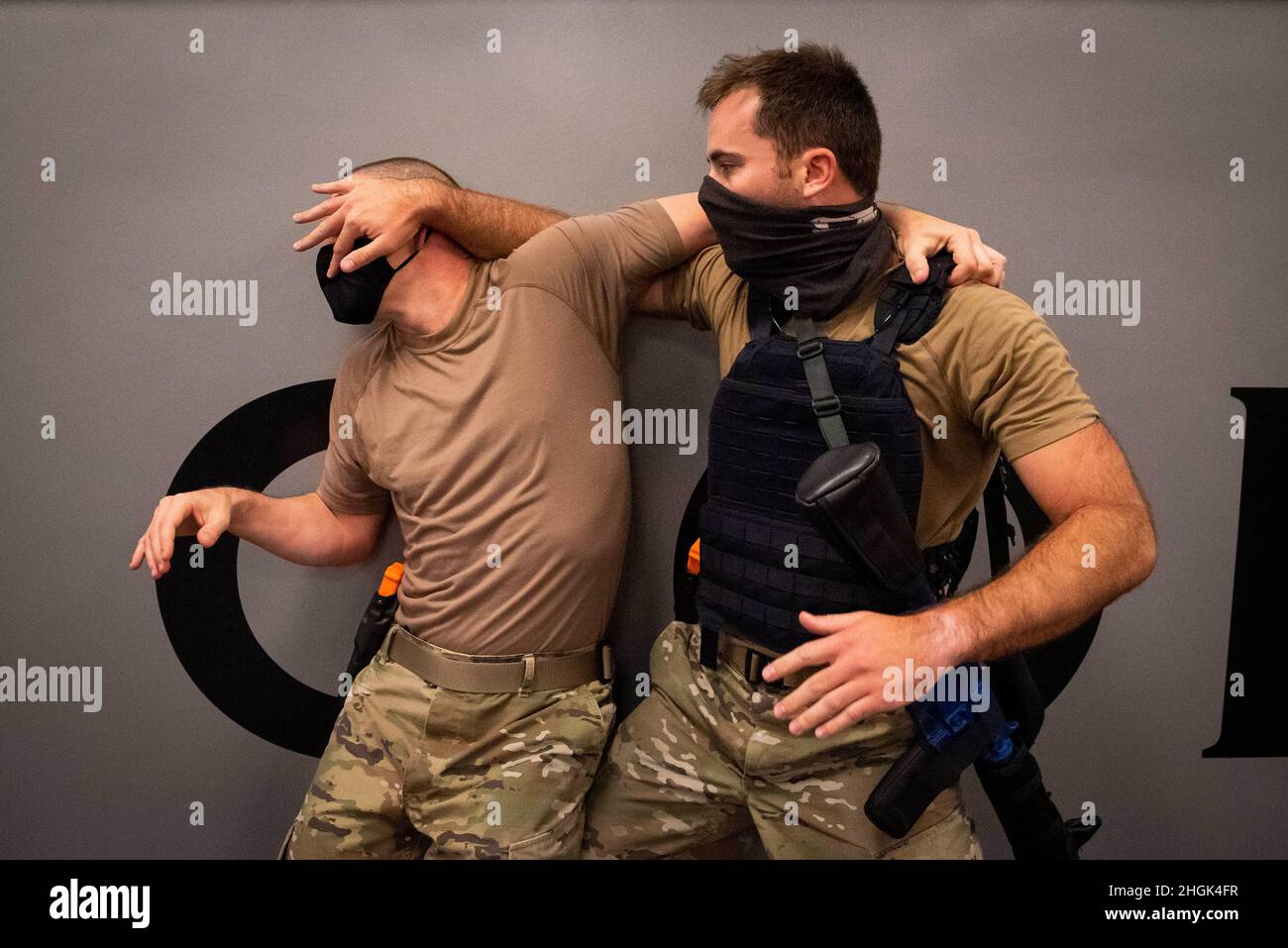 U.S. AIR FORCE ACADEMY, Colo. -- Capt Will Deauor, right, uses a clinch ...