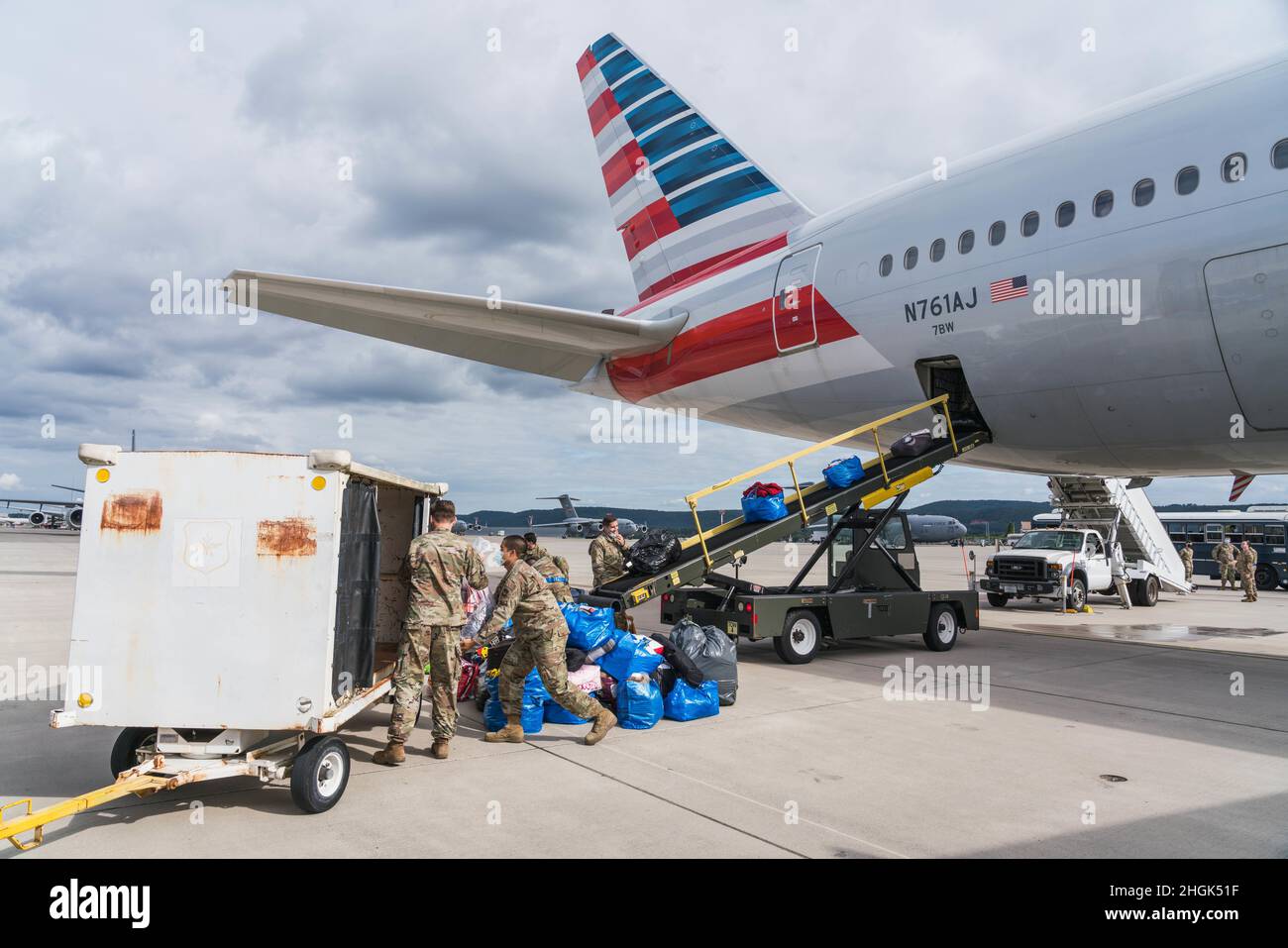 U.S. Air Force Airmen assigned to the 721st Aerial Port Squadron load ...