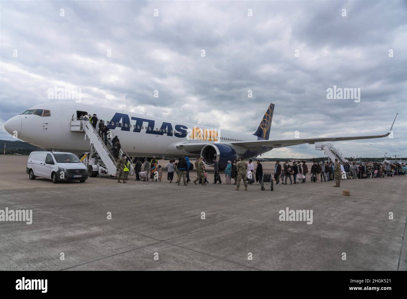 Passengers board an Atlas Air aircraft at Ramstein Air Base, Germany ...