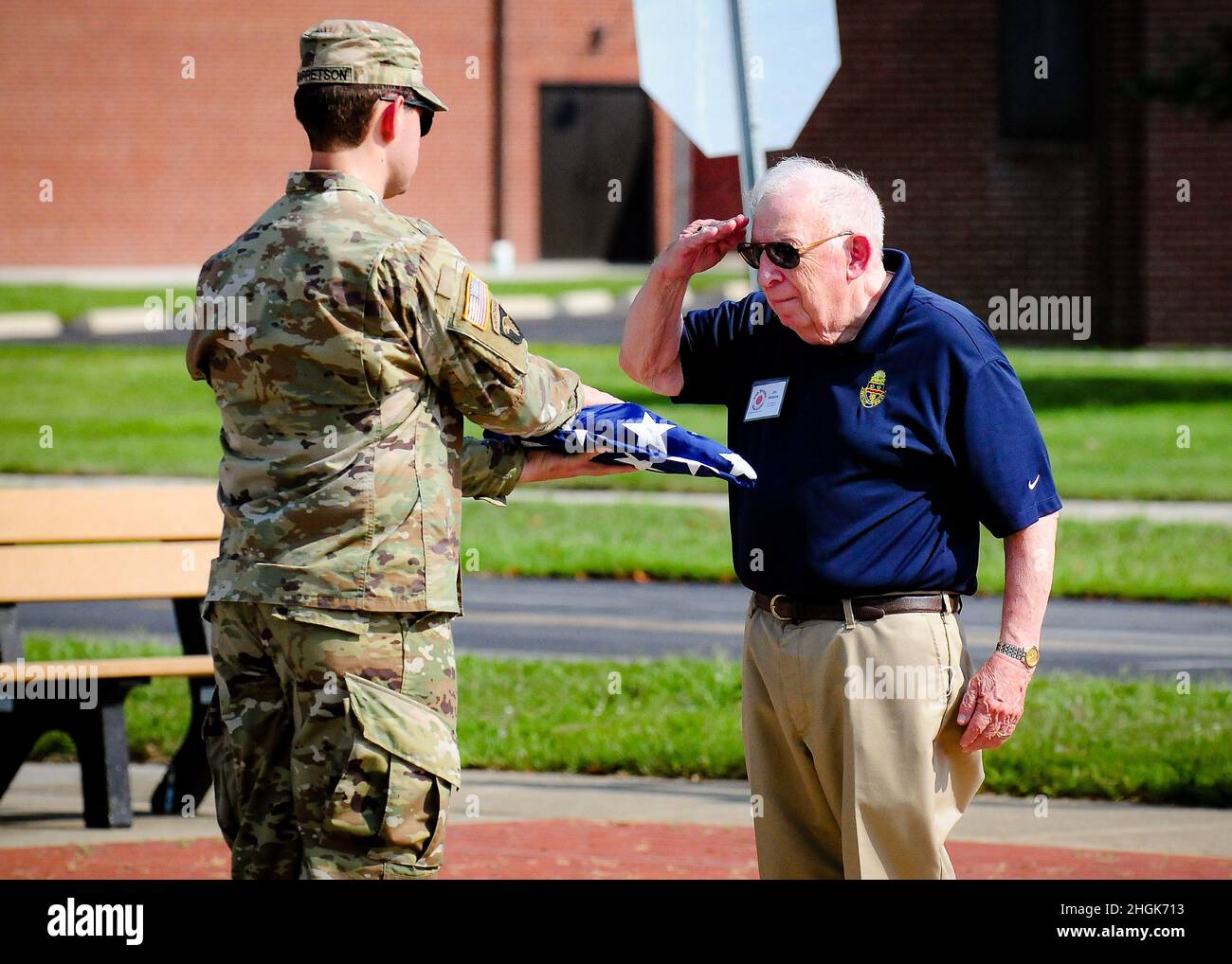 Retired Maj. Gen. James Williams (right) salutes as Staff Sgt. Aaron ...