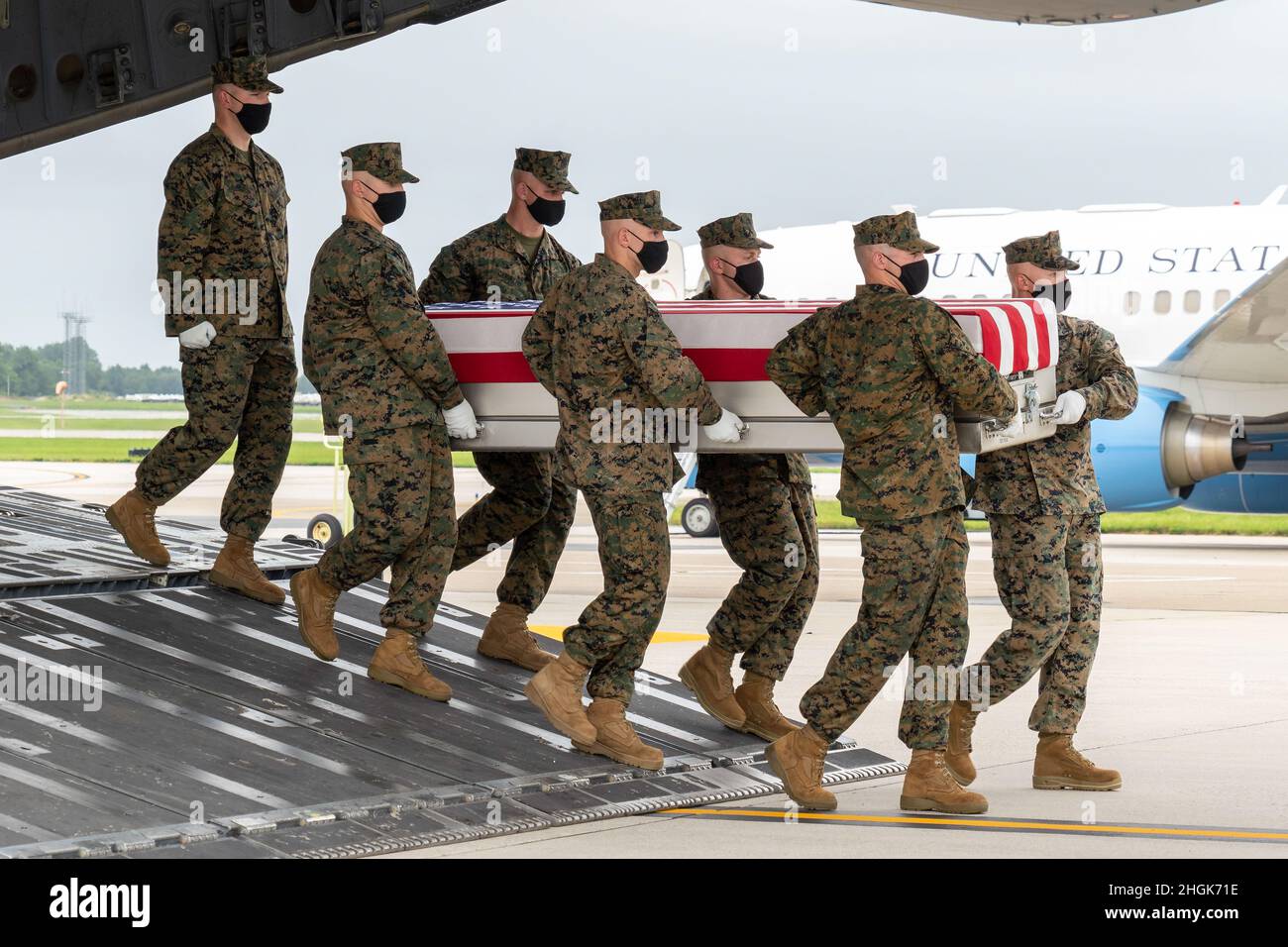 A U.S. Marine Corps carry team transfers the remains of Marine Corps ...