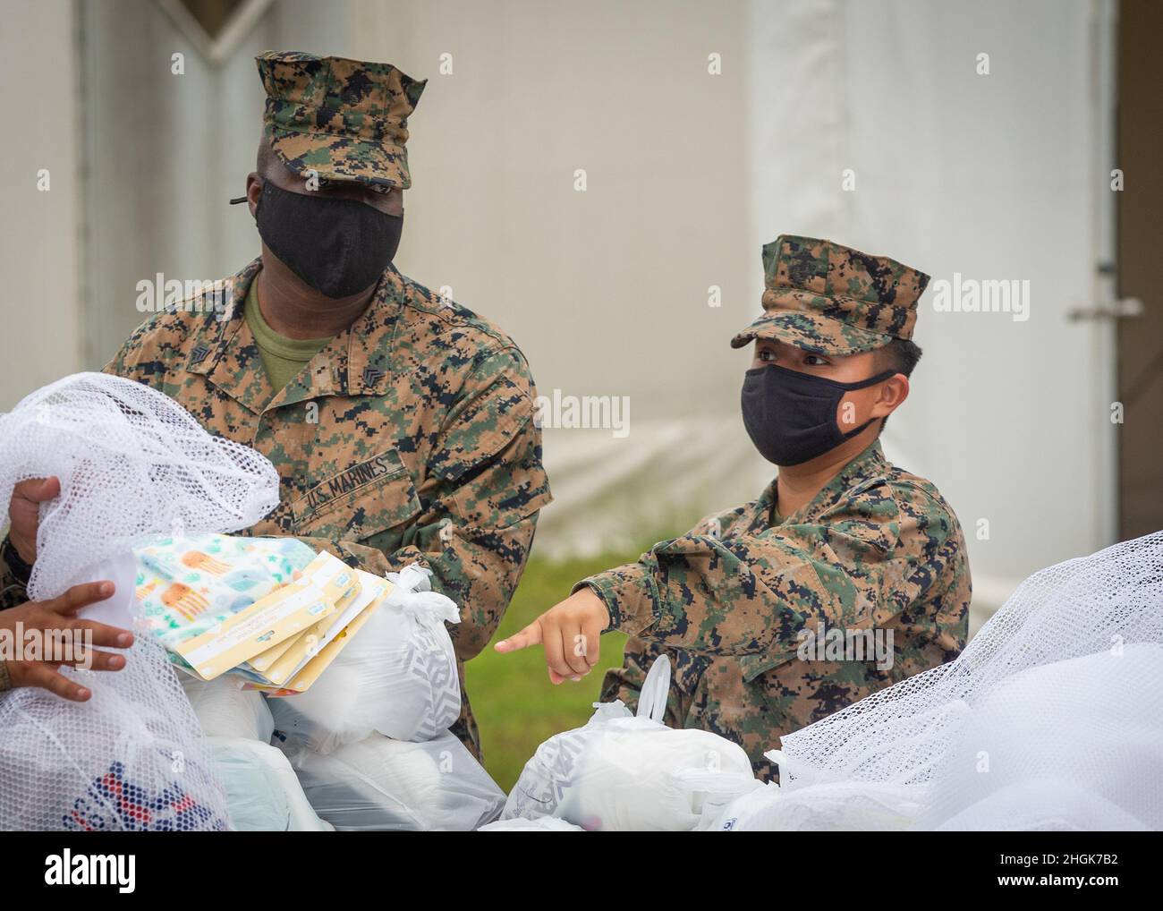 U.S. Marine Corps Sgt. Nackia Ferguson, left, a native of Brooklyn, N.Y ...