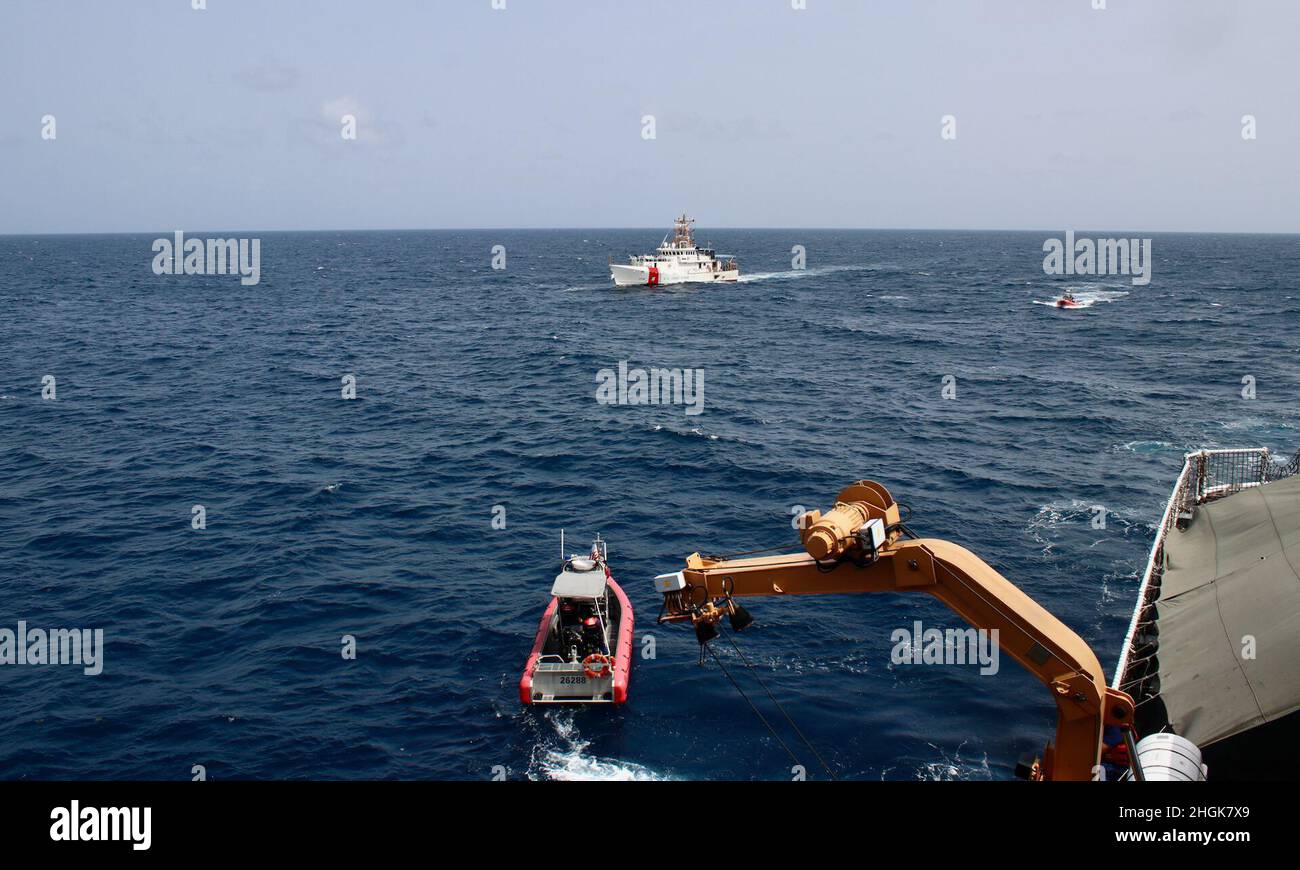 The crew of USCGC Reliance (WMEC 615) transfer passengers with the ...