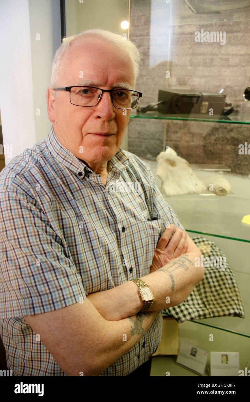 John Kelly in front of the display at the Museum for Free Derry of the ...