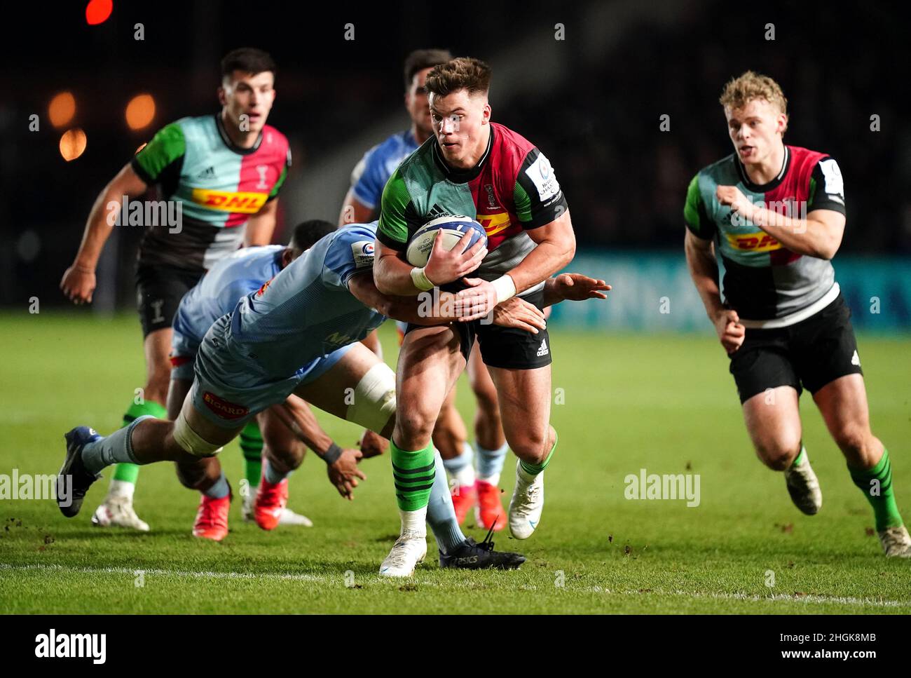 Harlequins' Huw Jones is tackled by Castres' Nick Champion de Crespigny ...