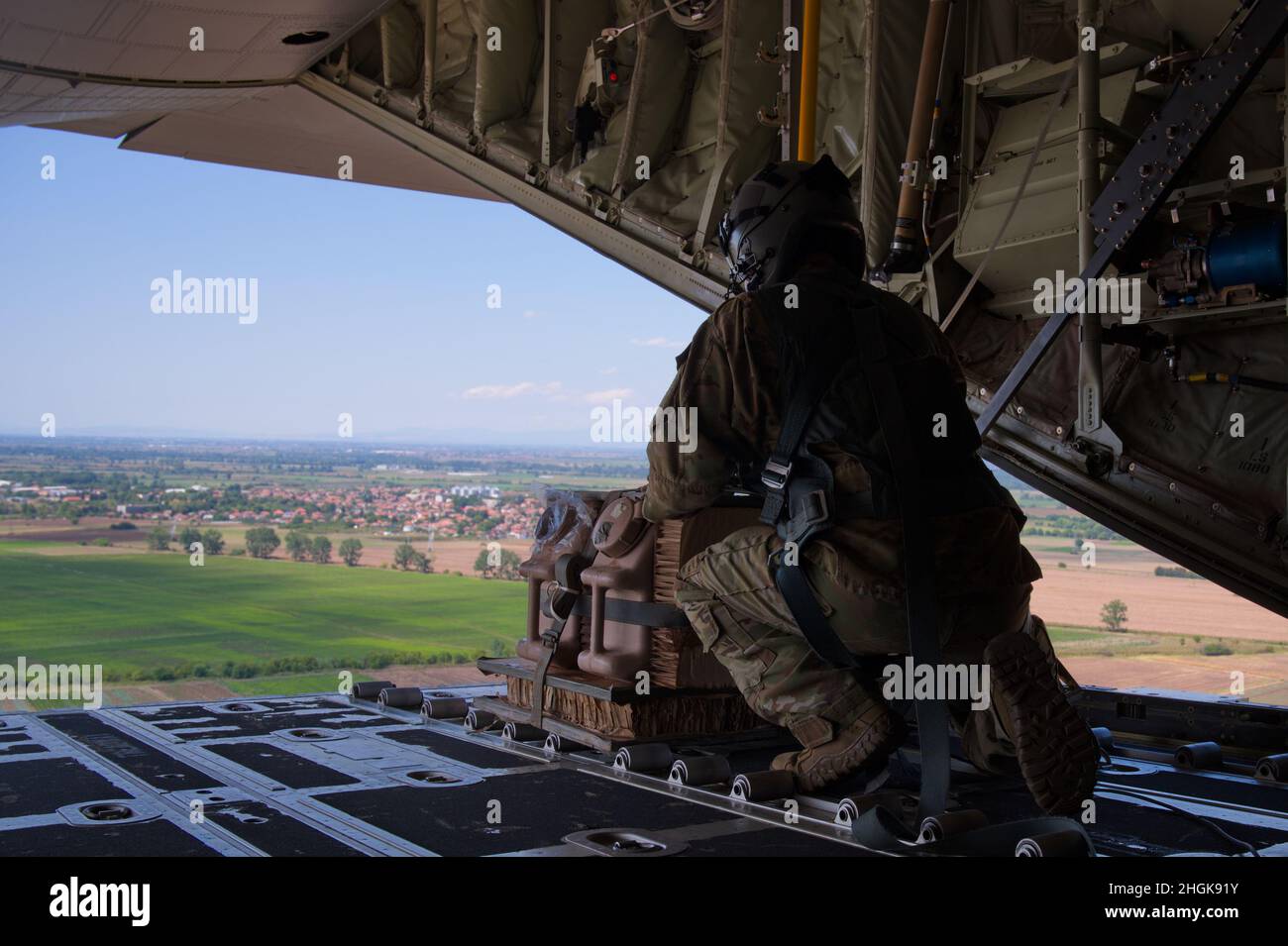A U.S. Air Force loadmaster from the 37th Airlift Squadron prepares to ...