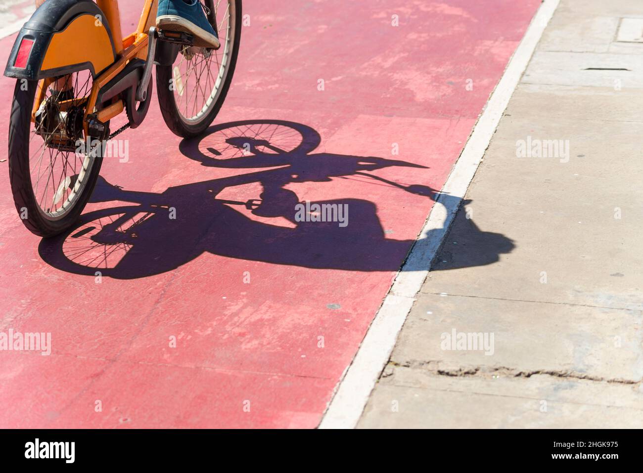 Shadow cyclist biking on road hi-res stock photography and images - Alamy