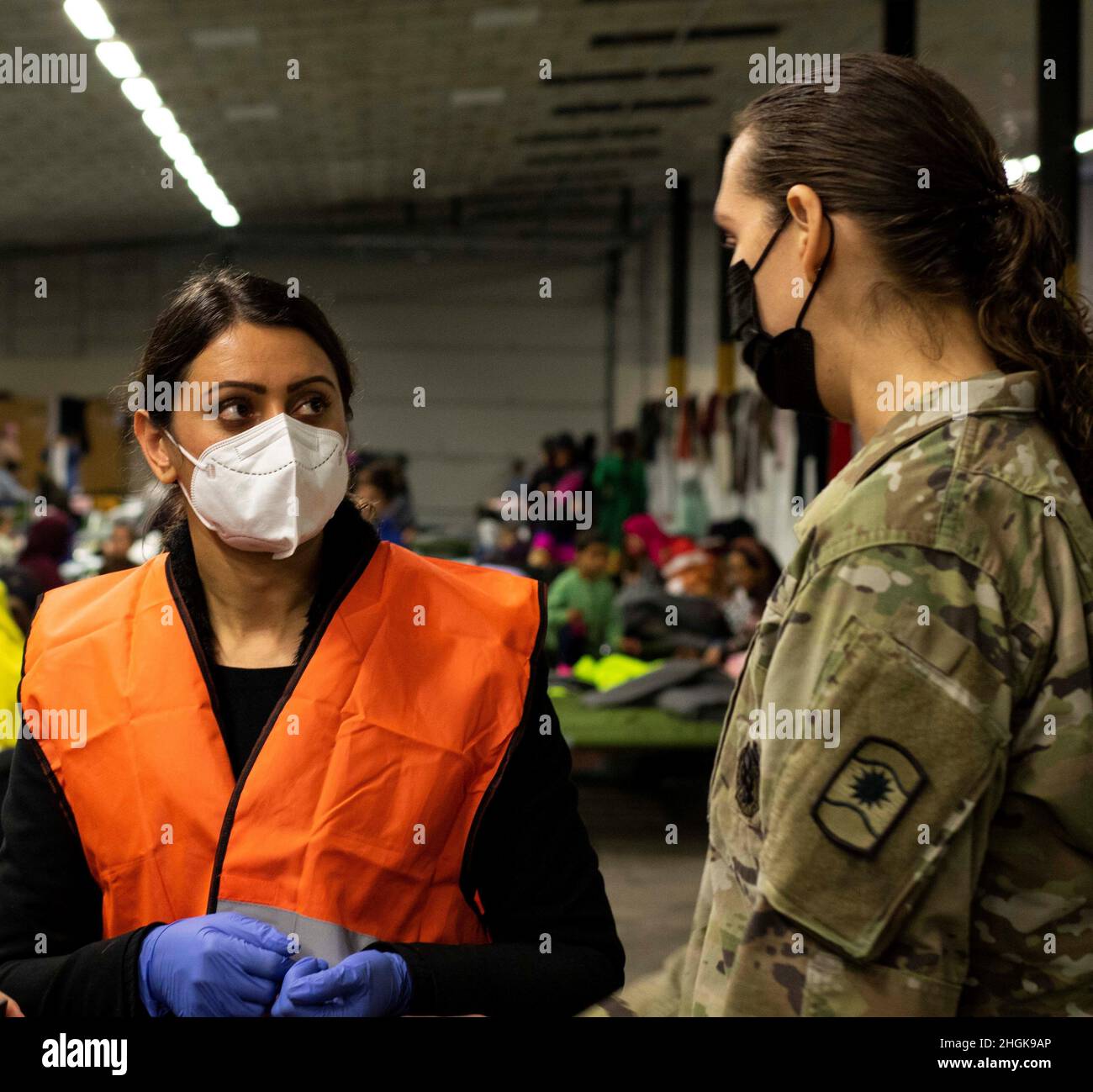 U.S. Army Staff Sgt. Angela Morrow, right, a civil affairs specialist ...