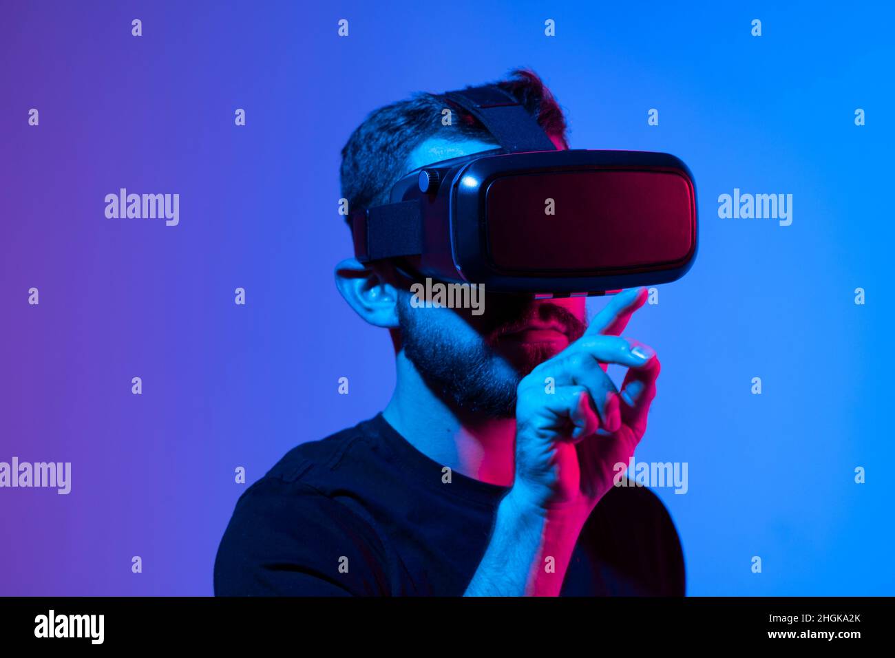 Future innovation technology concept. Portrait of young man wearing VR ...