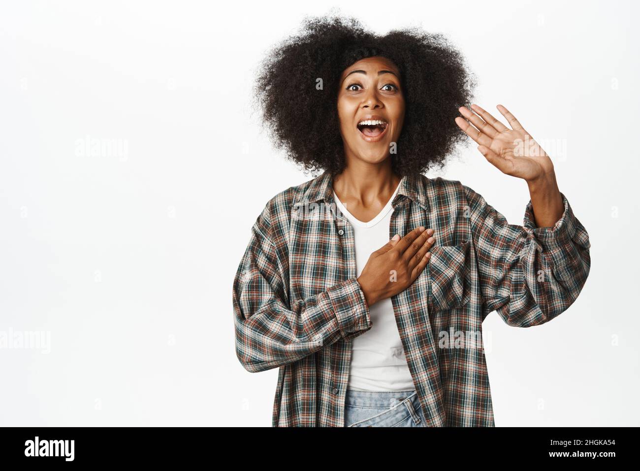Excited young african american woman name herself, raising hand and ...