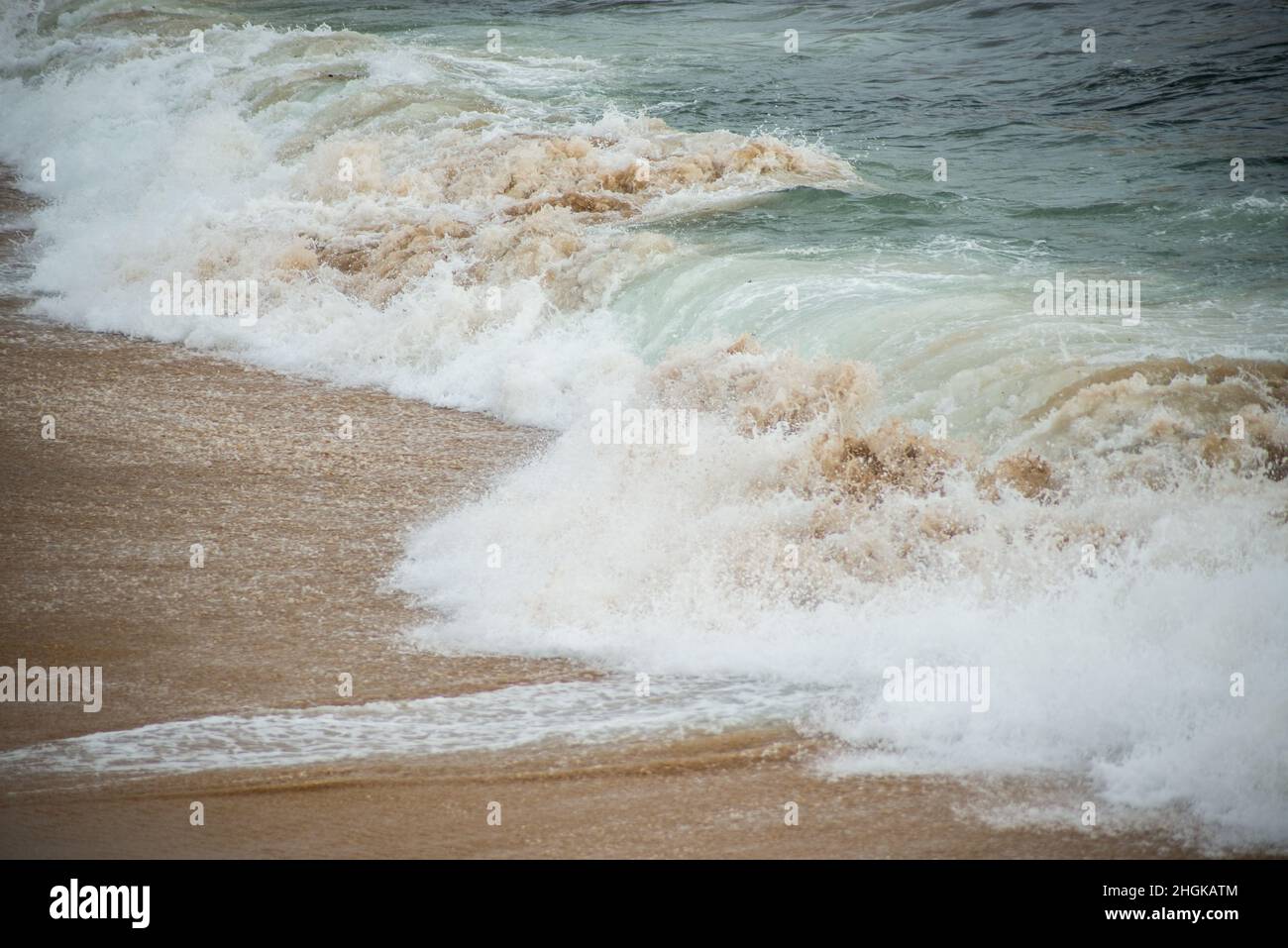 Ocean waves breaking on the sands of the famous Rio Vermelho beach ...