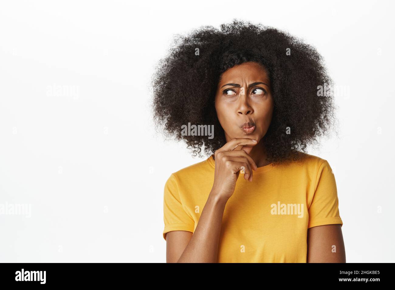Close up of african american woman deep thinking, looking hesitant away ...