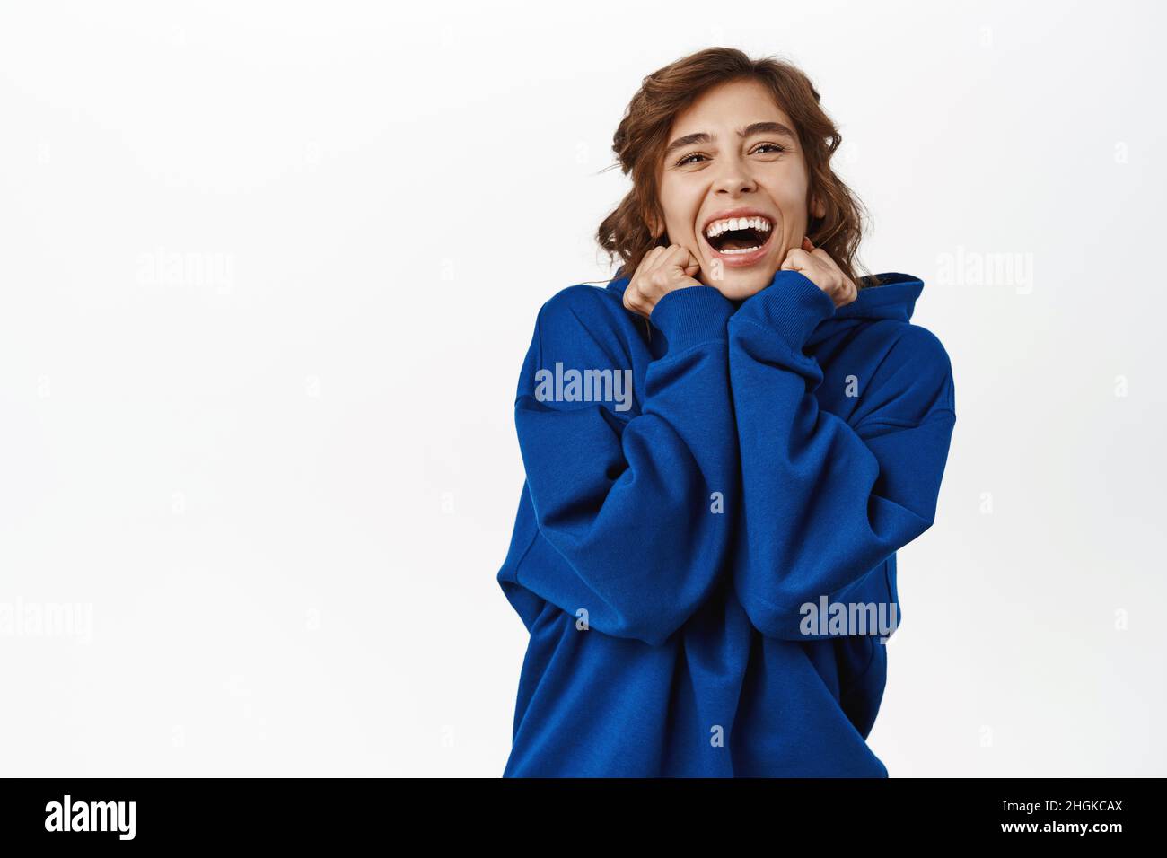 Winner, celebration. Portrait of enthusiastic young woman winning ...