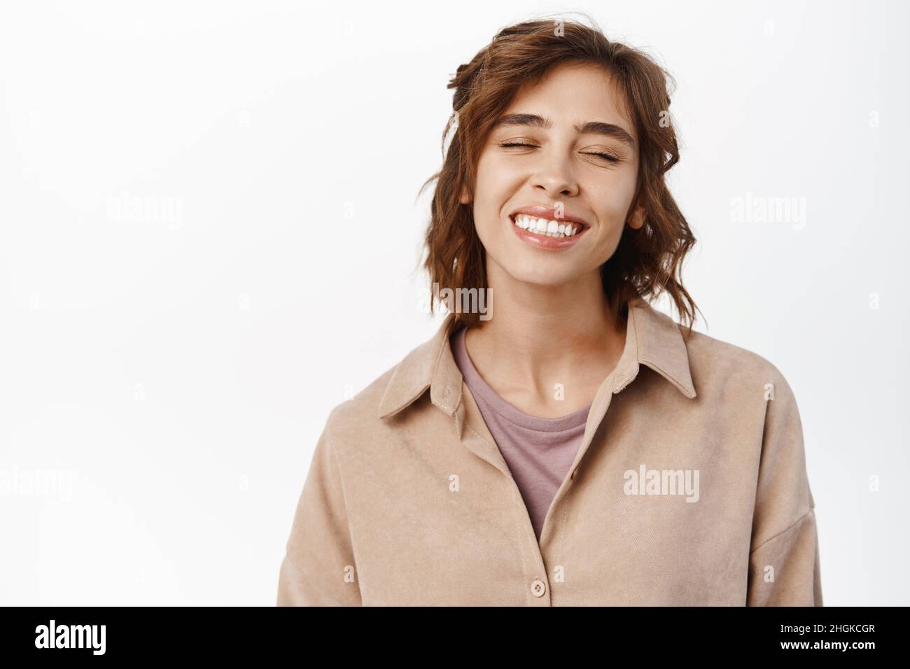 Smiling woman dreaming, close eyes and imaging product, thinking ...