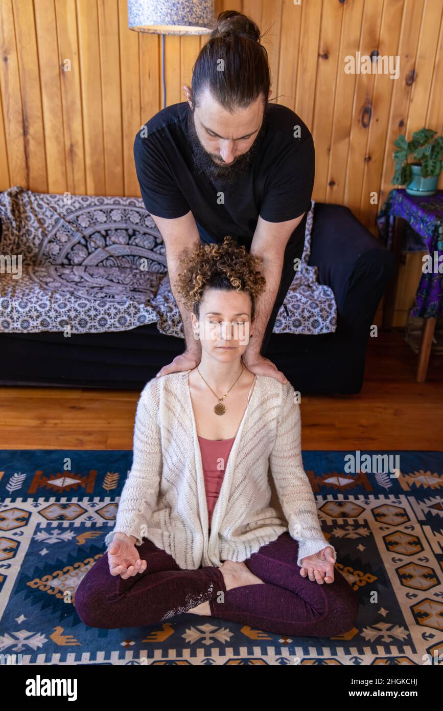 Close up and front view of a caucasian woman, seated in the lotus ...