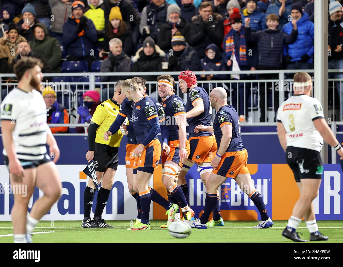 Edinburgh's Ben Muncaster celebrates scoring their side's seventh try ...