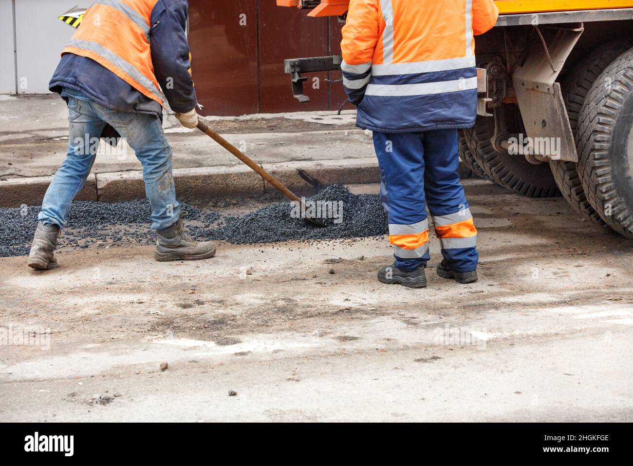 Construction worker repairing holes on hi-res stock photography and ...