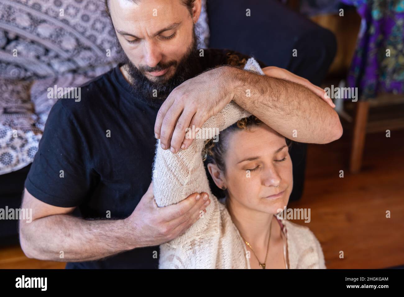 Closeup view on the head and upper body of a man and woman during ...