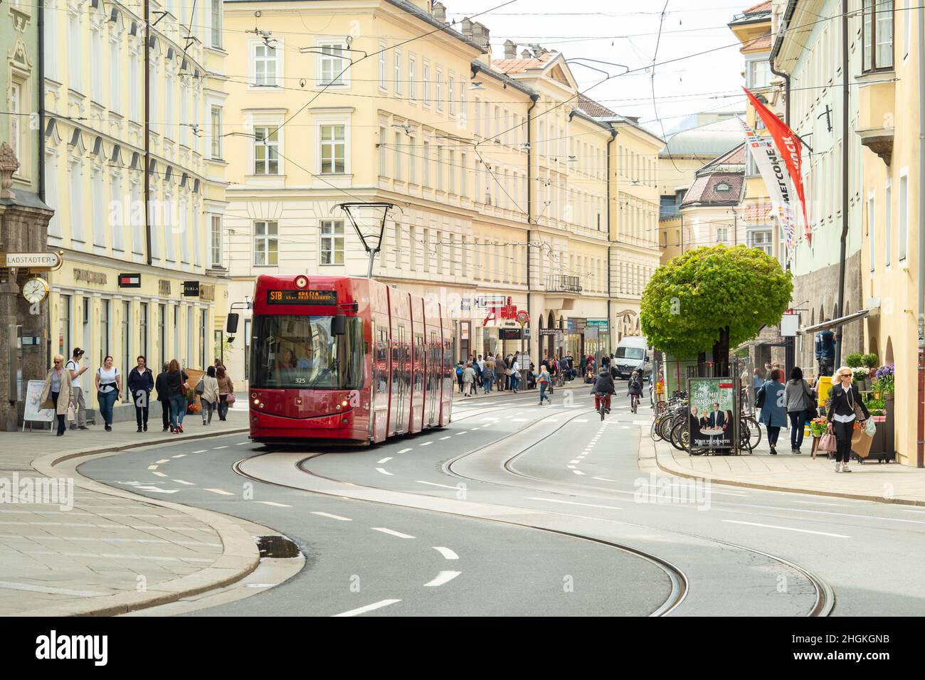 Innsbruck, Austria - April 17th 2018: A red coloured tram passing the ...