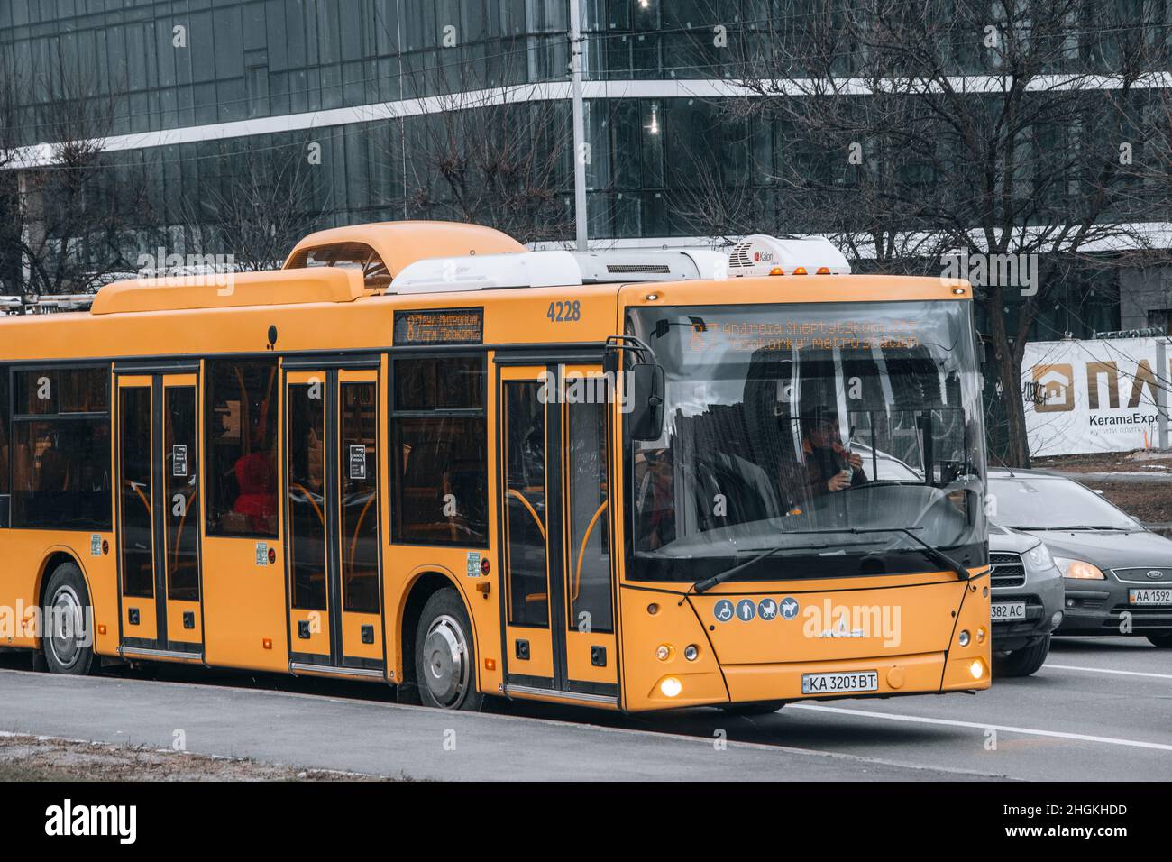 Ukraine, Kyiv - 15 January 2022: Yellow public transport bus car moving ...