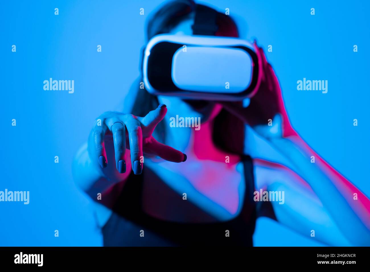 Young girl playing game using VR glasses, enjoying virtual reality ...