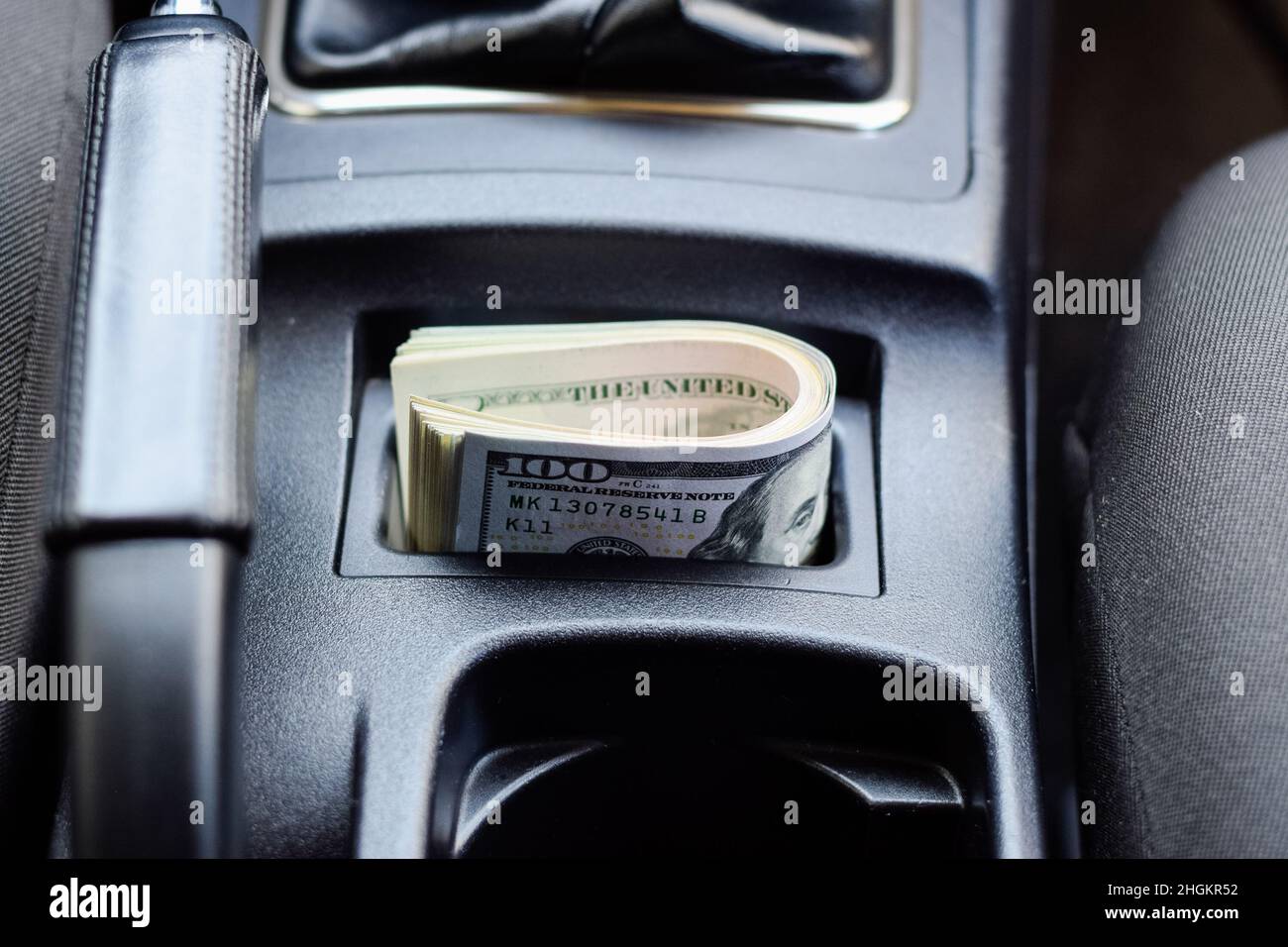 A wad of dollars inside the car. A wad of dollars inside the car Stock ...