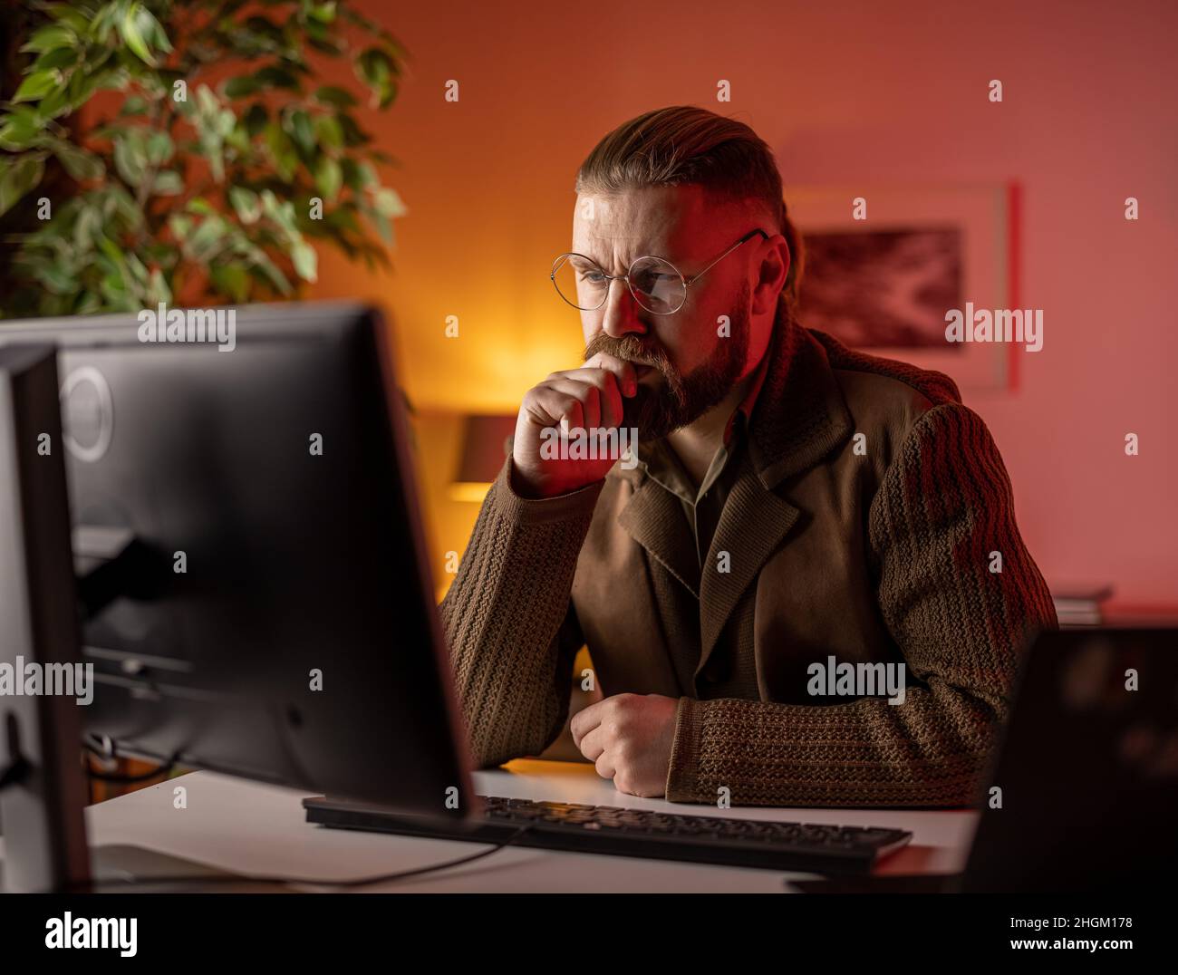 Man working desktop pc Stock Photo - Alamy