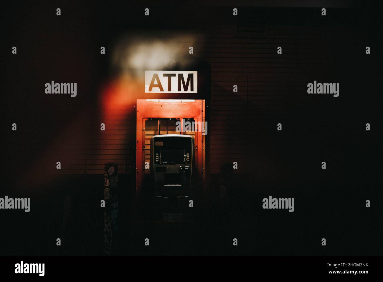 An ominous ATM machine outside of a building at night Stock Photo - Alamy