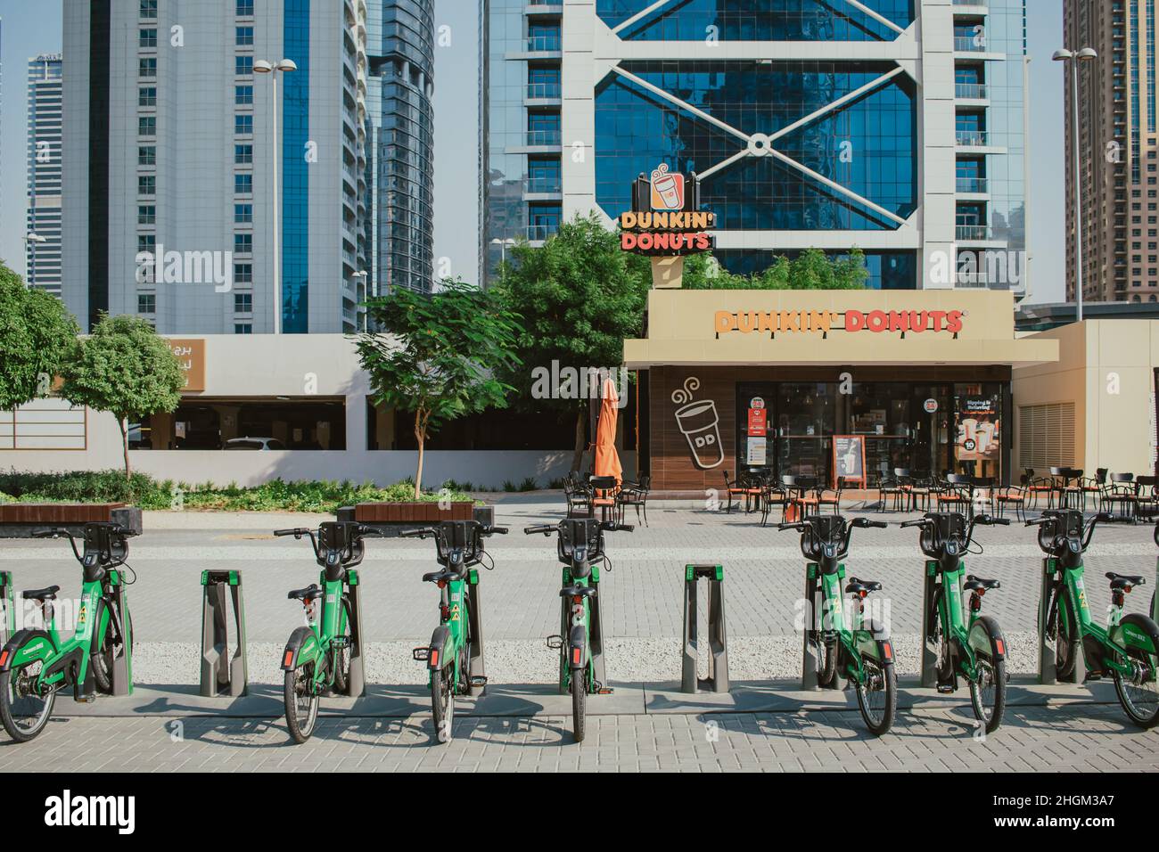 Green eco-friendly bike public rentals in a row located outside in a ...