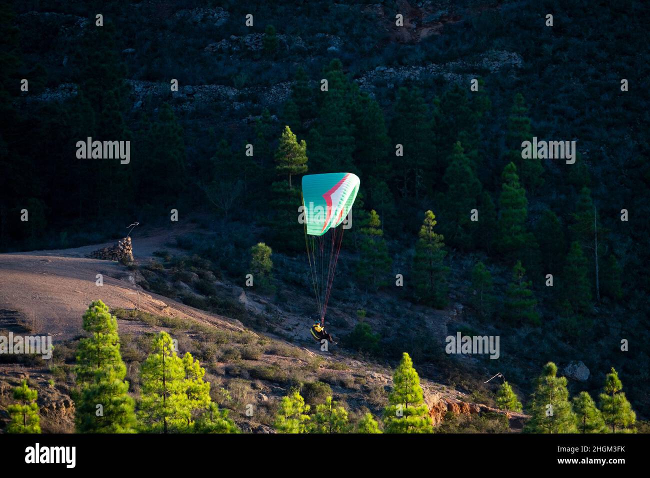 Paragliding activity concept with blue paraglide start to fly in the ...