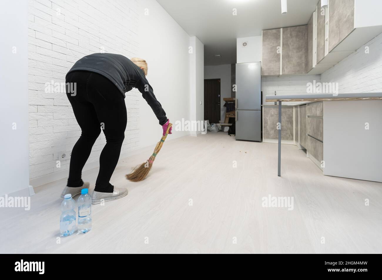 Cleaning lady in room after renovation Stock Photo - Alamy