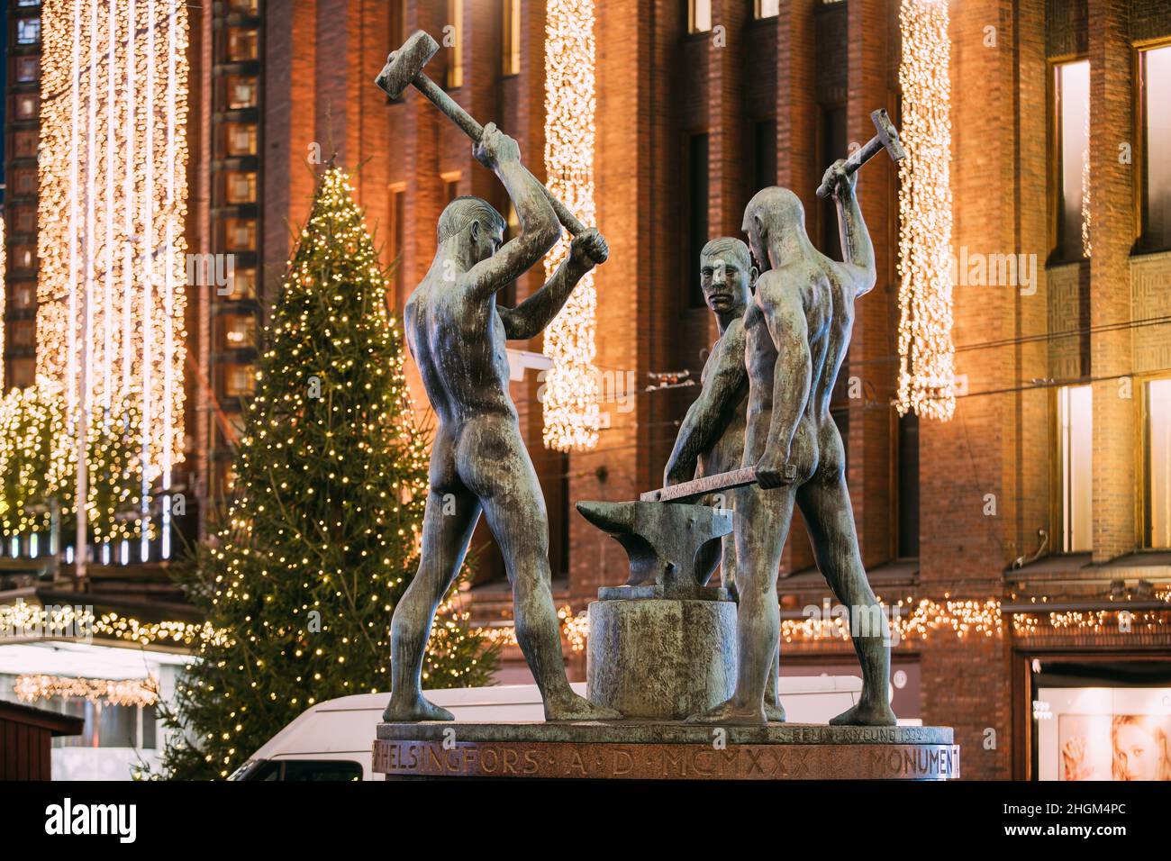 Helsinki, Finland. Night View Of Famous Sculpture Group Three Smiths ...