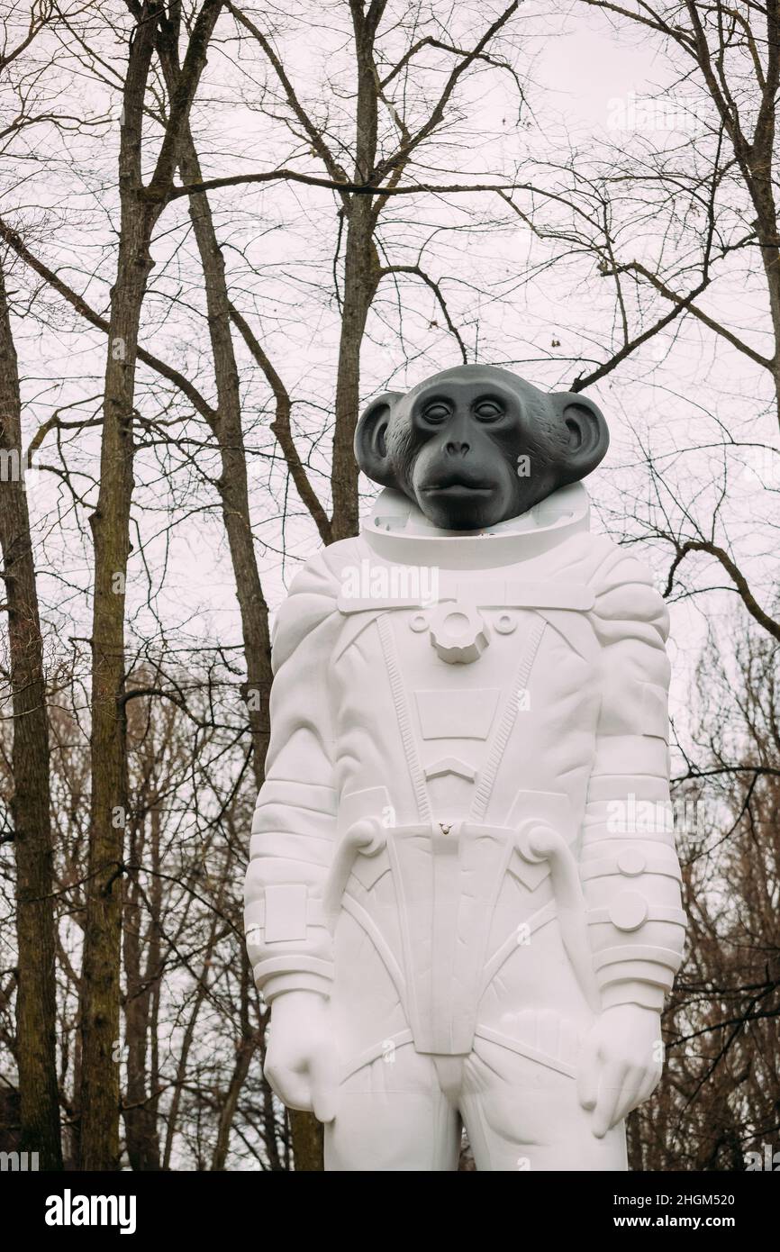 Riga, Latvia. Monkey statue in a spacesuit in Kronvalda park. Statue is ...