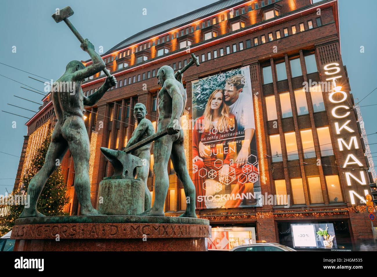 Helsinki, Finland. Night View Of Famous Sculpture Group Three Smiths ...