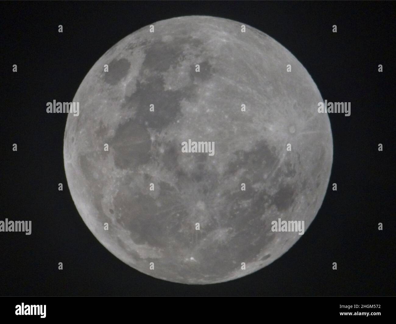 Closeup of a bright full moon in Ecuador showing fine detail of lunar ...