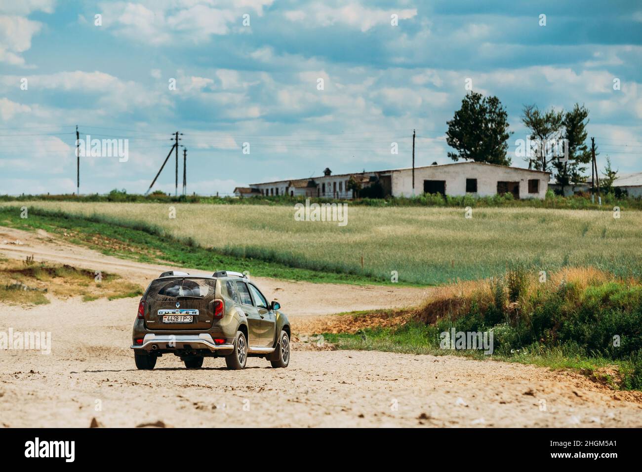 Dirty Car Renault Duster or Dacia Duster SUV in countryside landscape ...