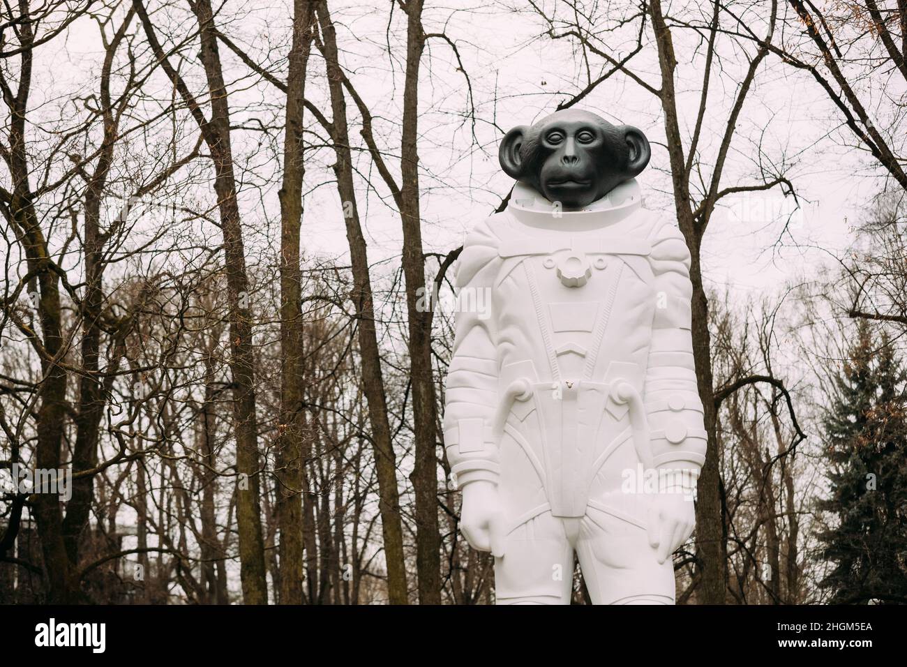 Riga, Latvia. Monkey statue in a spacesuit in Kronvalda park. Statue is ...