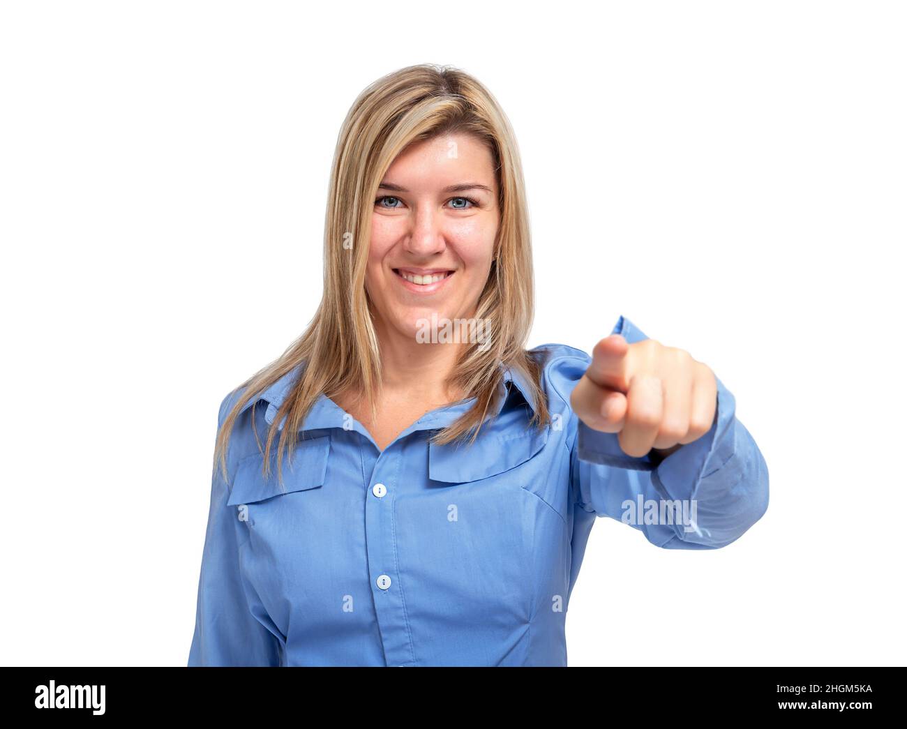 Smiling young woman pointing with index finger at camera isolated on ...
