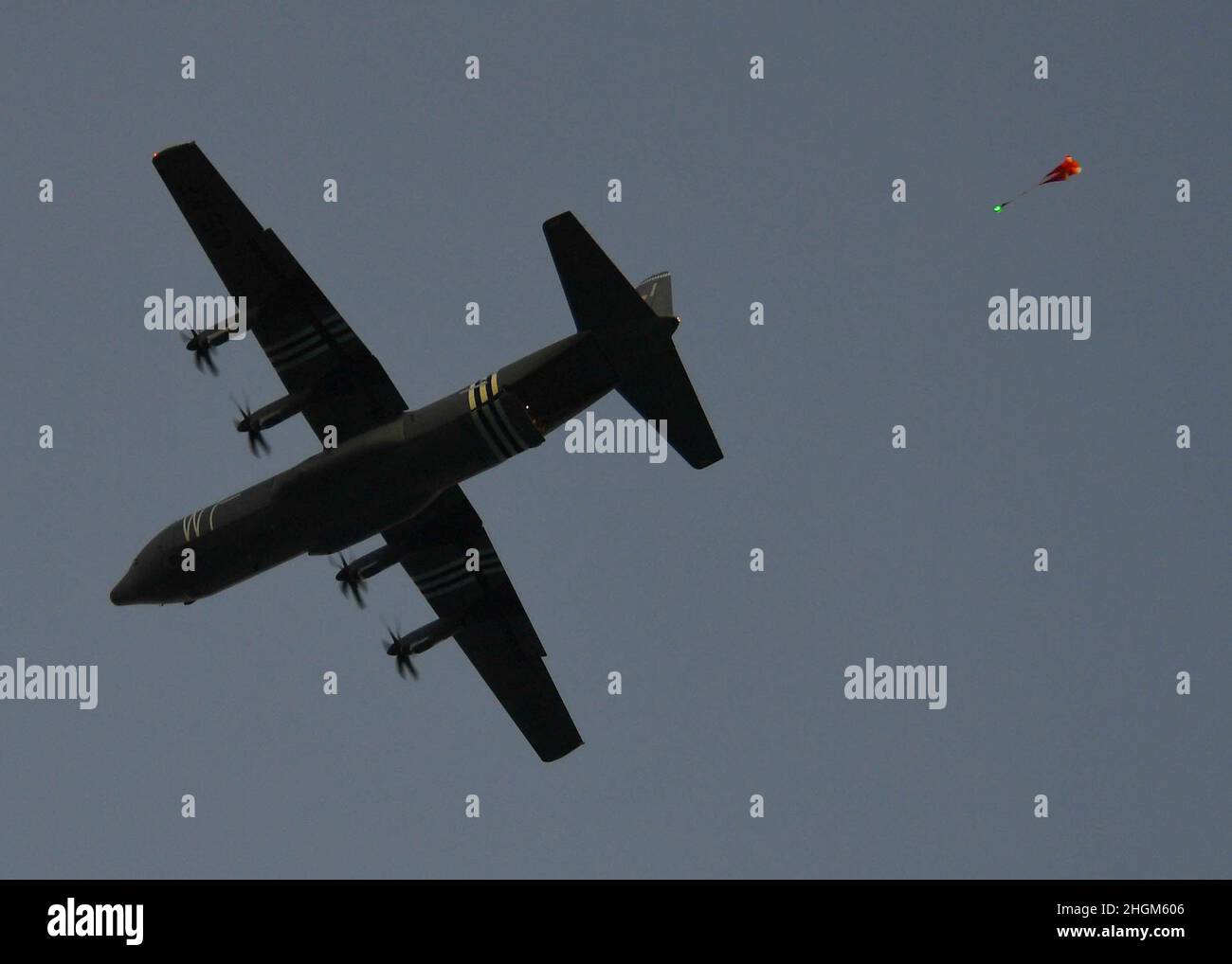 The 57th Rescue Squadron drop a search and rescue night light devicel ...