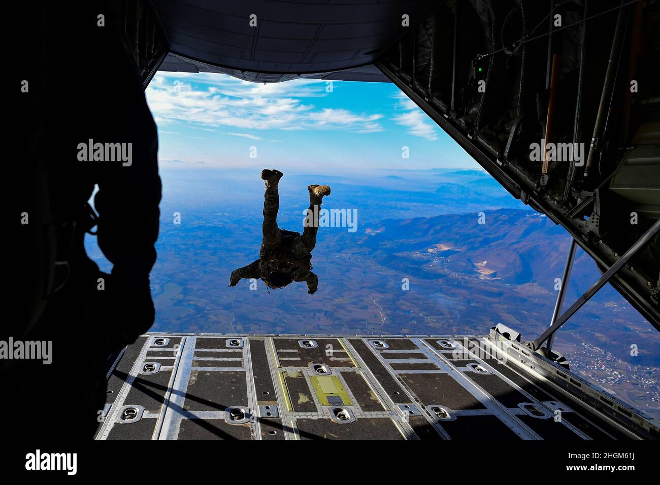 An airman assigned to the 57th Rescue Squadron performs a free fall ...