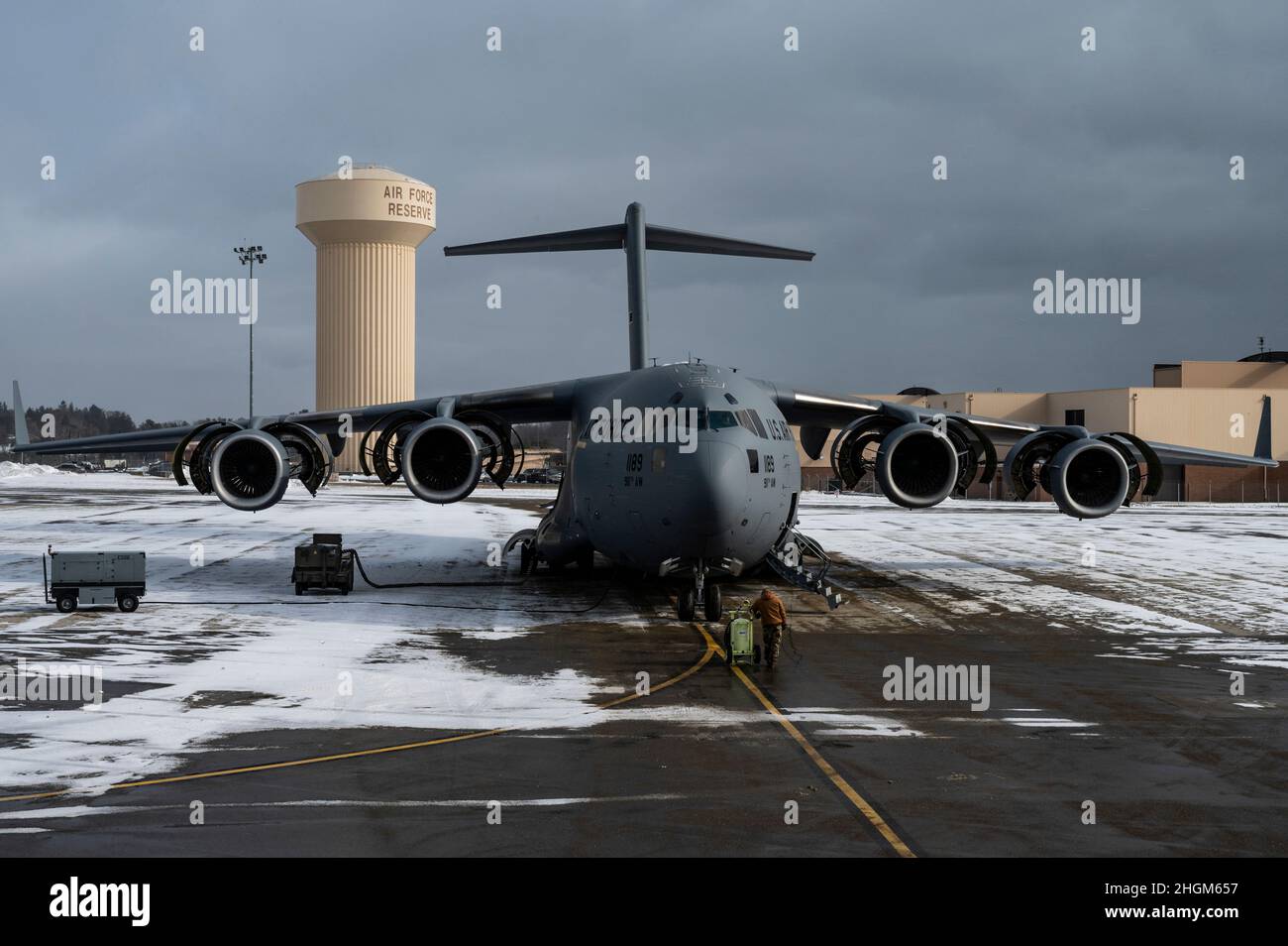 Airmen assigned to the 911th Maintenance Group prepare a C-17 ...