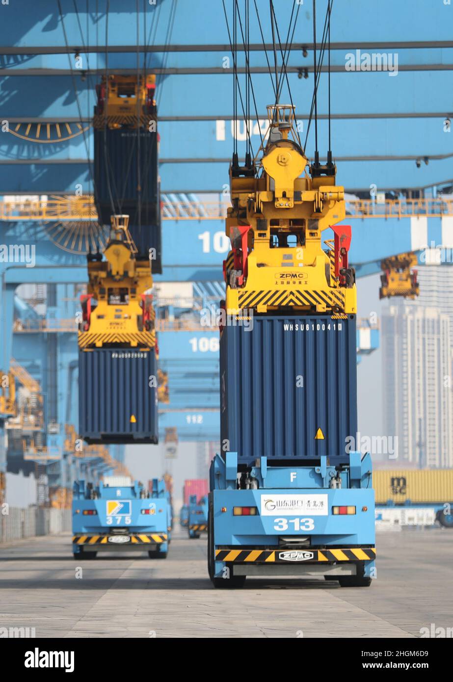 QINGDAO, CHINA - JANUARY 21, 2022 - Automatic guided vehicles shuttle ...